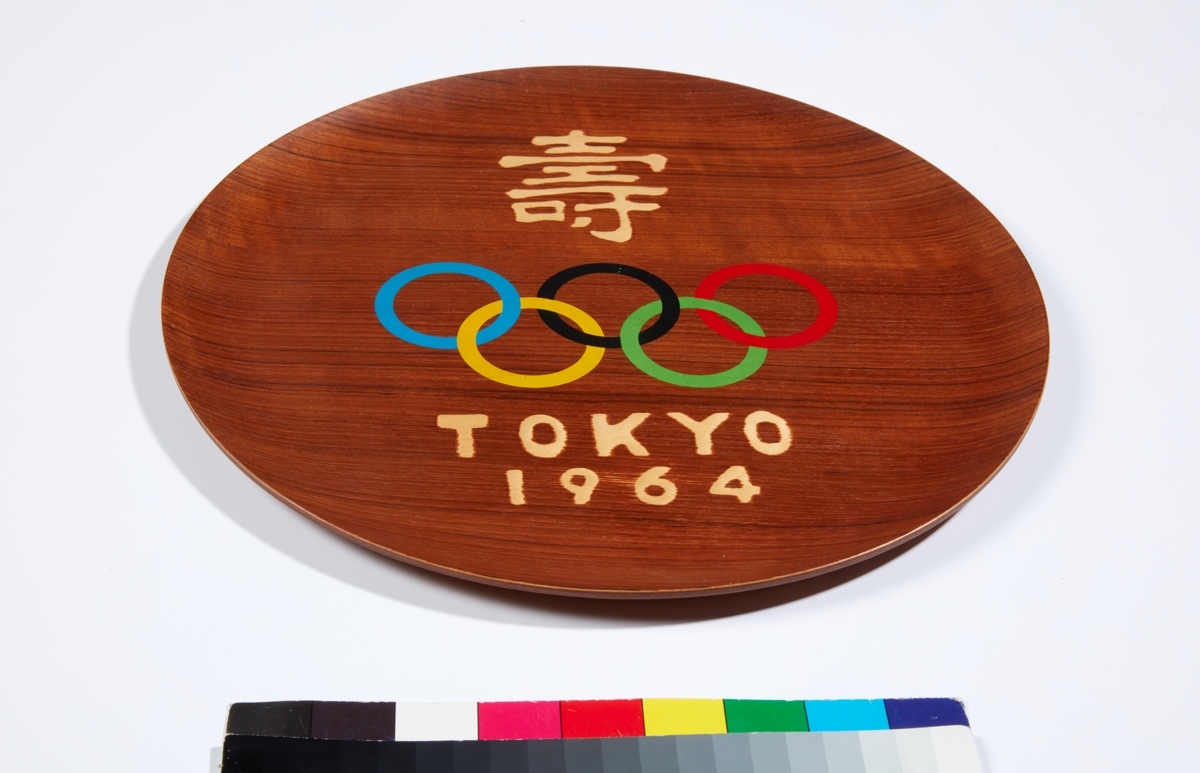 Olympic Museum-Tokyo 1964, wooden plate with the Olympic symbol.