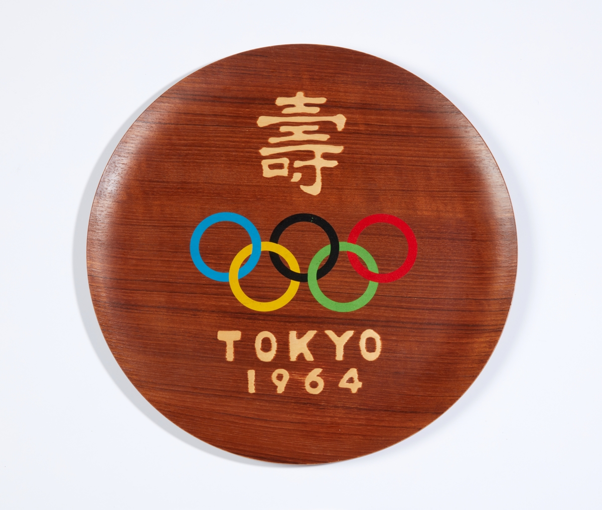 Olympic Museum-Tokyo 1964, wooden plate with the Olympic symbol.